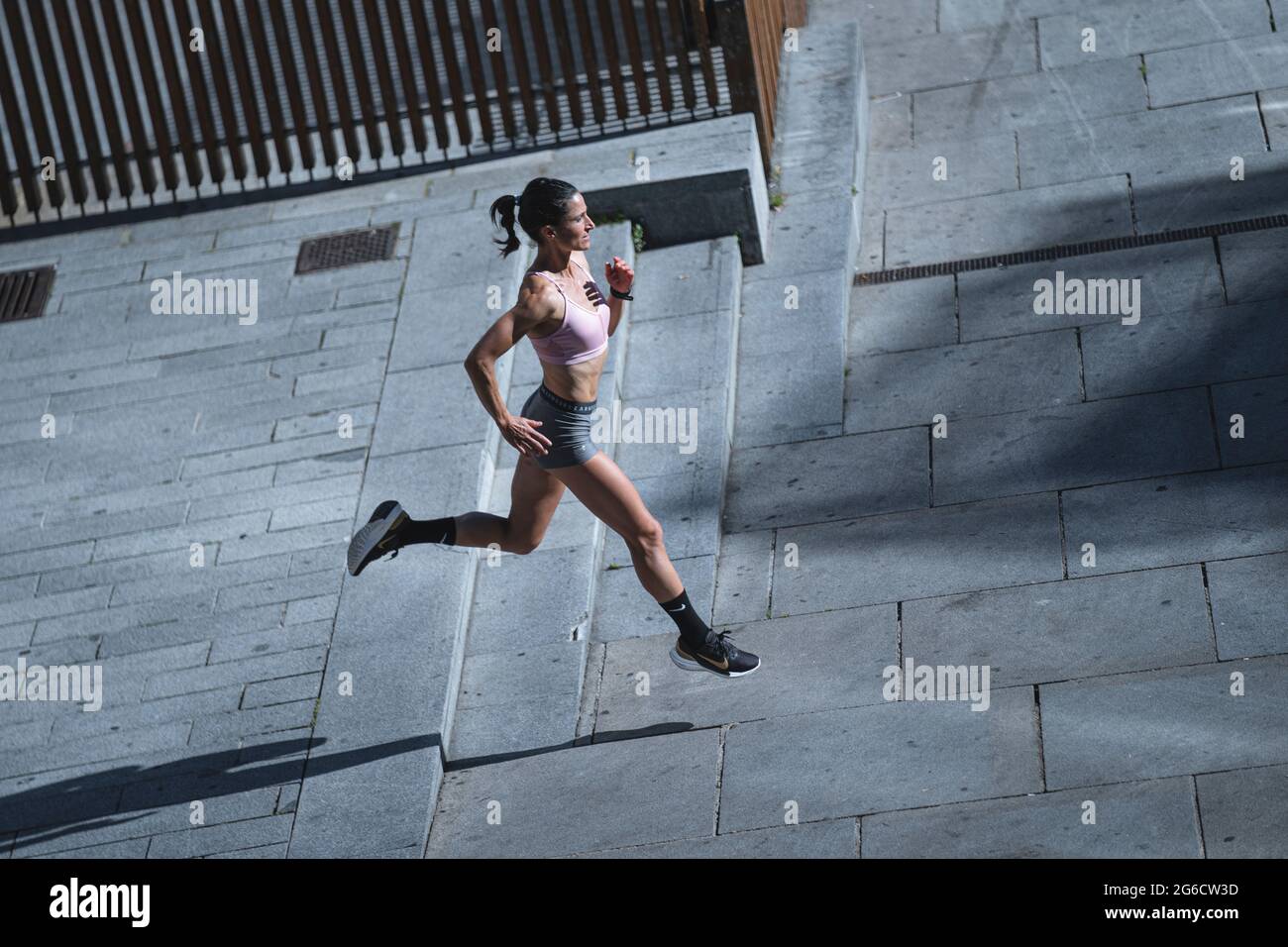 Girl running in the city, it's her lifestyle Stock Photo - Alamy