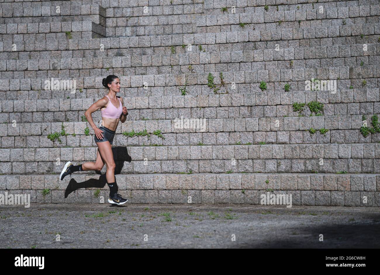 Girl running in the city, it's her lifestyle Stock Photo - Alamy