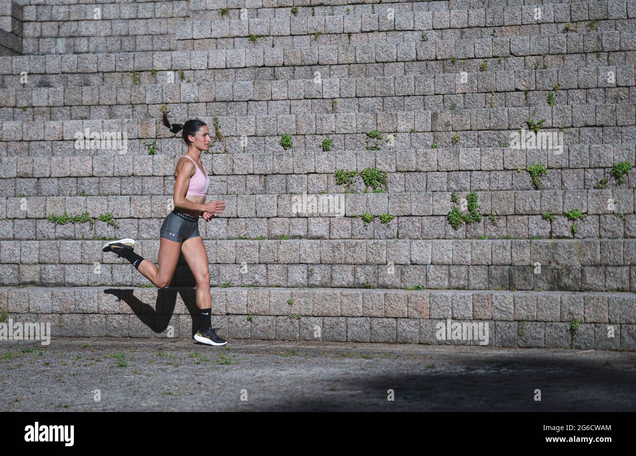 Girl running in the city, it's her lifestyle Stock Photo - Alamy
