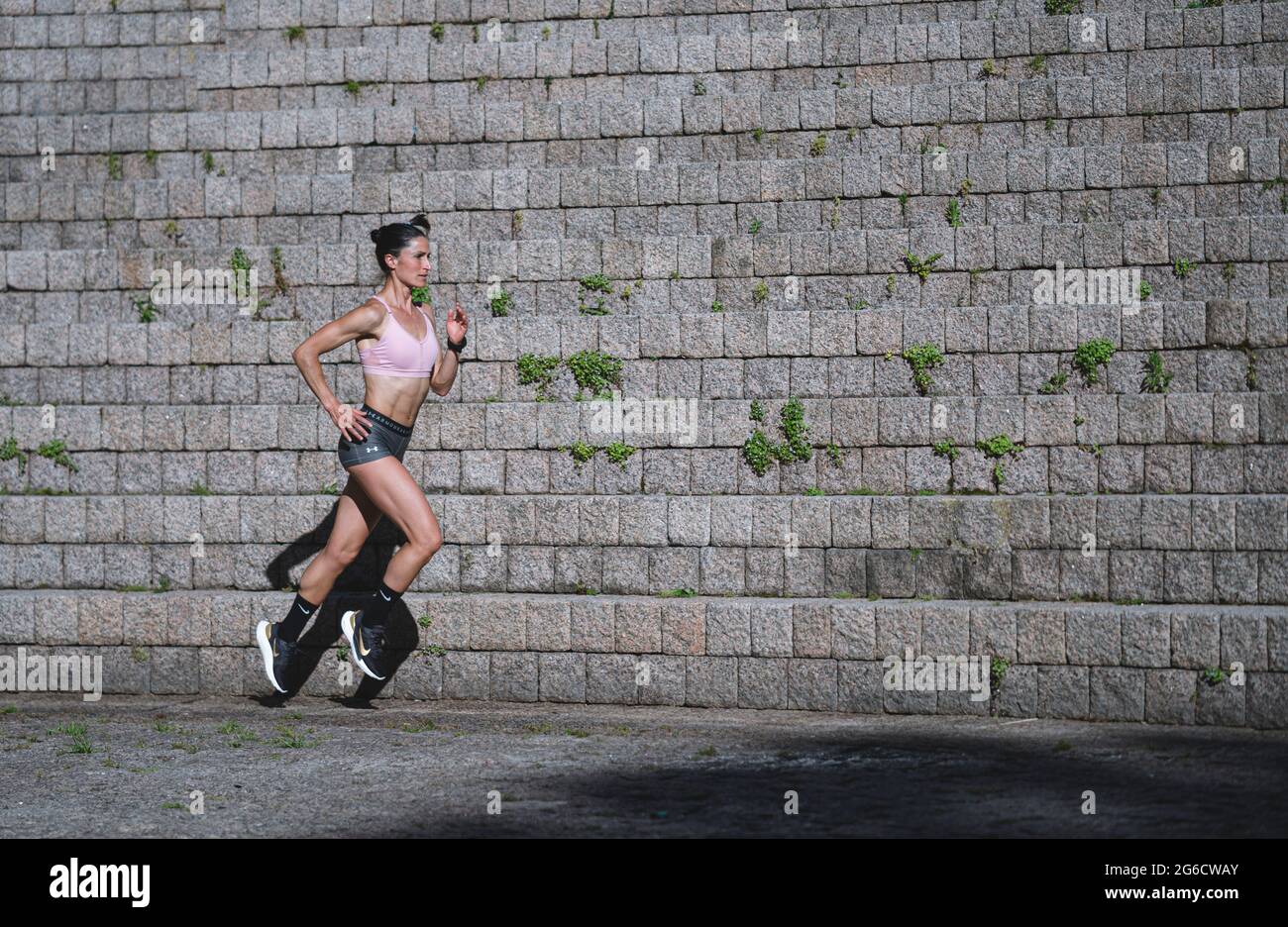 Girl running in the city, it's her lifestyle Stock Photo - Alamy