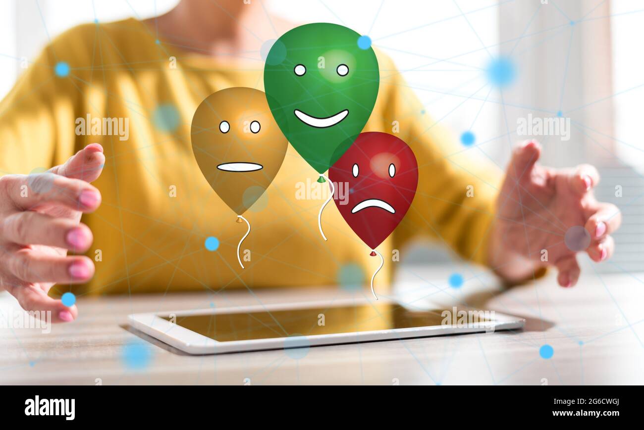 Digital tablet with customer satisfaction concept between hands of a ...