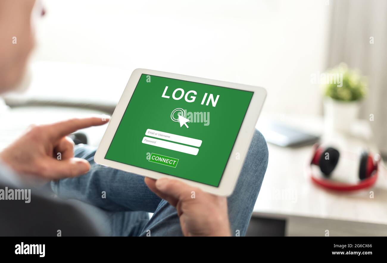 Tablet screen displaying a login concept Stock Photo - Alamy