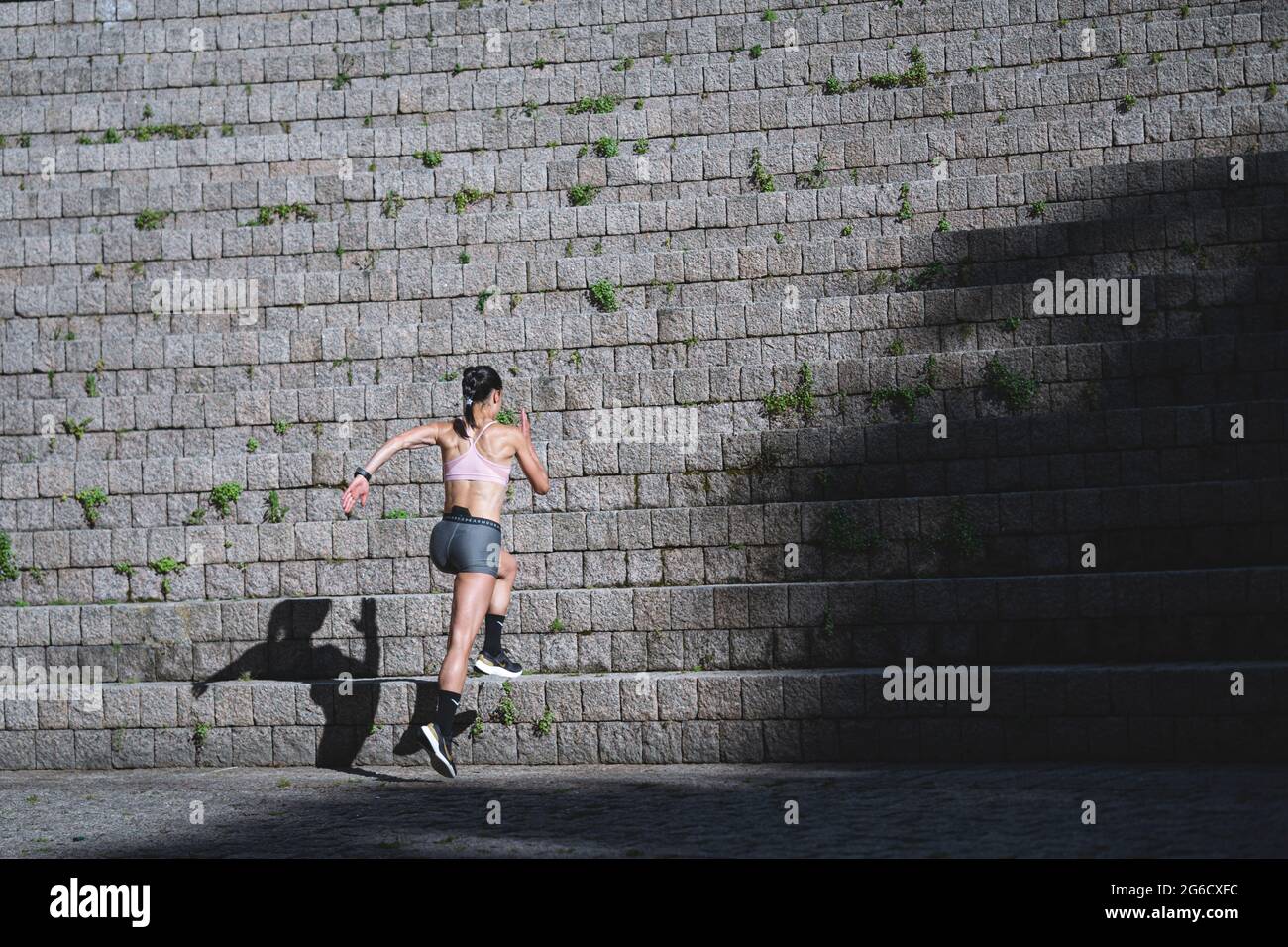 Girl running in the city, it's her lifestyle Stock Photo - Alamy