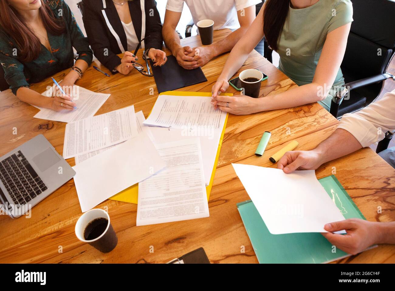 Business team hands on the table at work Stock Photo - Alamy