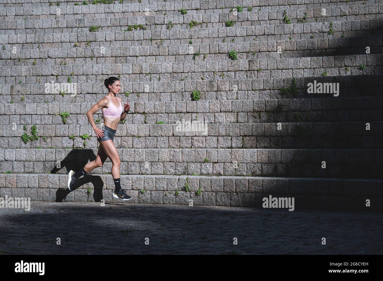 Girl running in the city, it's her lifestyle Stock Photo - Alamy