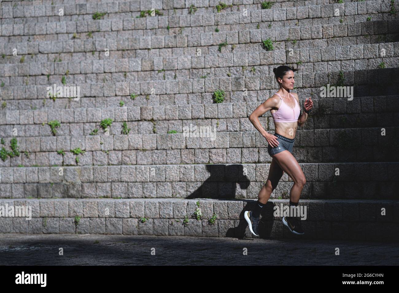 Girl running in the city, it's her lifestyle Stock Photo - Alamy