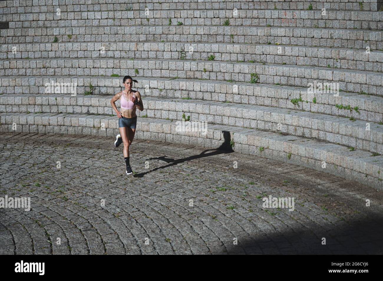 Girl running in the city, it's her lifestyle Stock Photo - Alamy