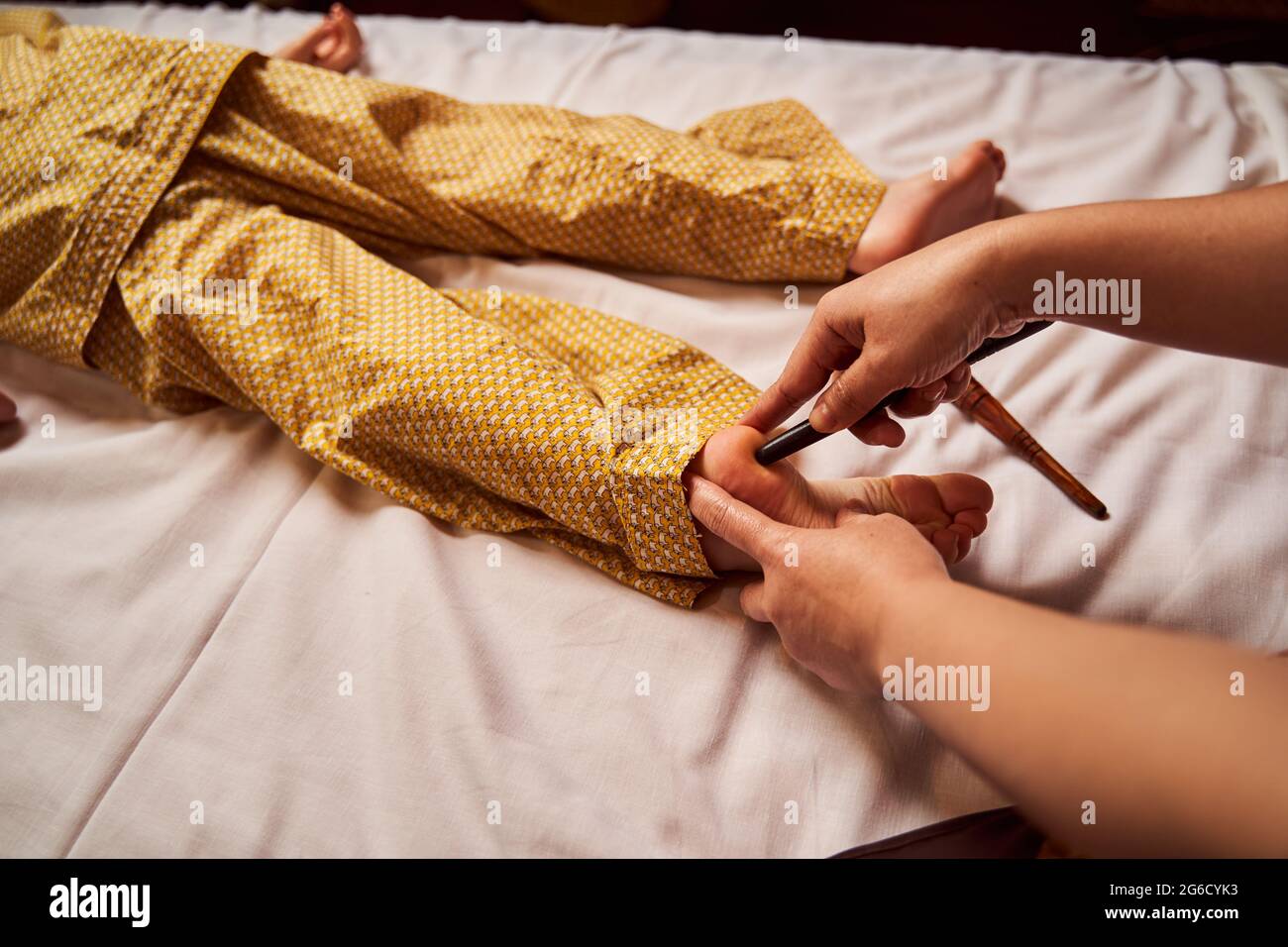 Professional therapist doing massotherapy to kid in cabinet Stock Photo ...