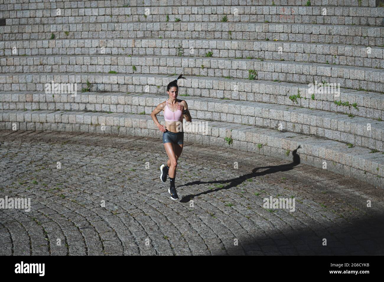 Girl running in the city, it's her lifestyle Stock Photo - Alamy