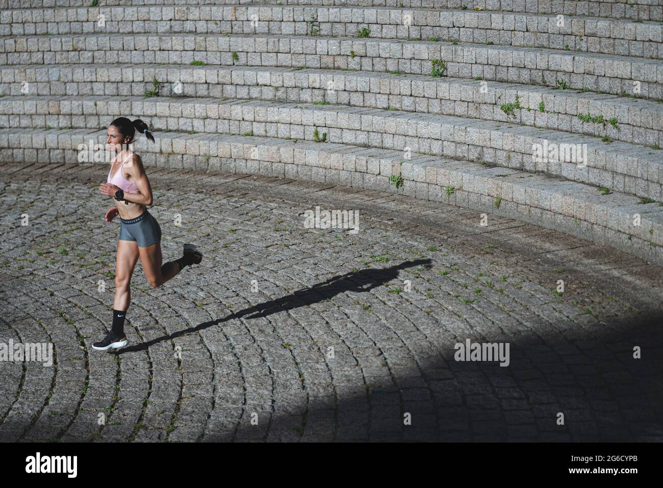 Girl running in the city, it's her lifestyle Stock Photo - Alamy