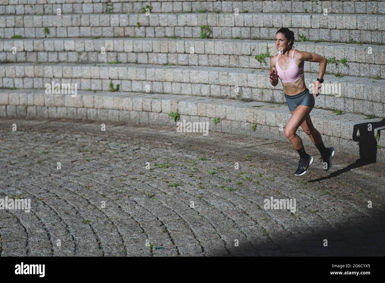 Girl running in the city, it's her lifestyle Stock Photo - Alamy