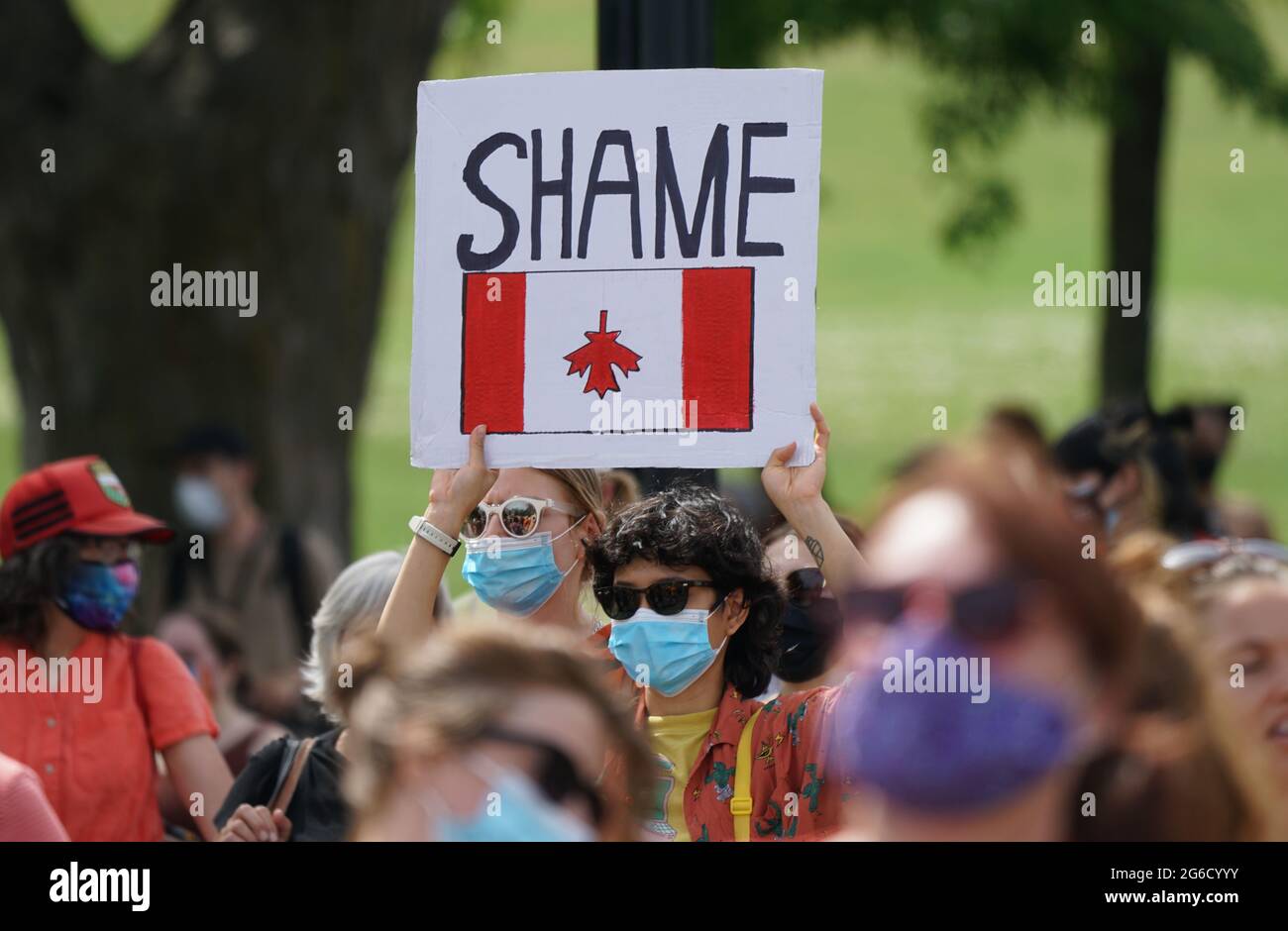 Montreal,Quebec,Canada,July 1, 2021.People carrying signs to protest ...