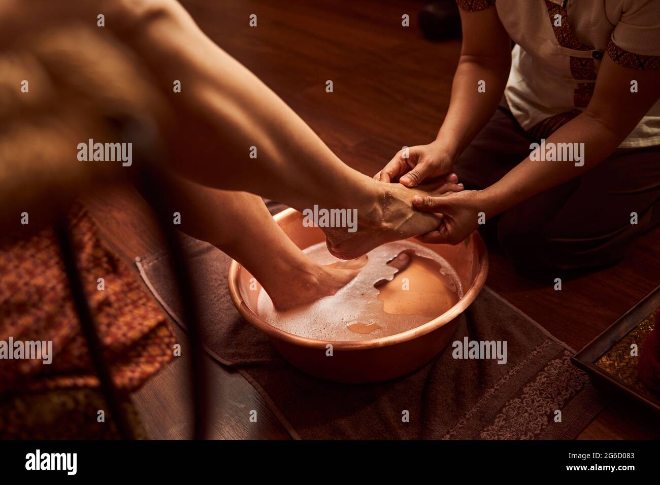 Woman washing foot in special container in spa salon Stock Photo - Alamy