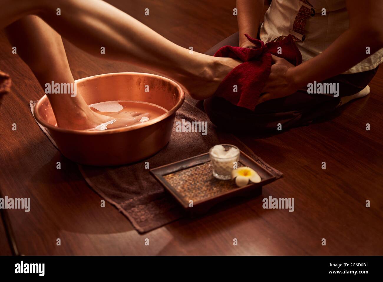 Woman washing foot in special container in spa salon Stock Photo - Alamy