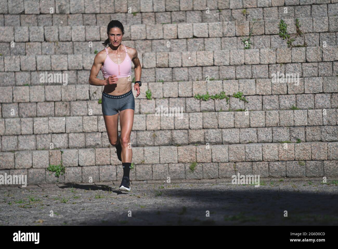 Girl running in the city, it's her lifestyle Stock Photo - Alamy