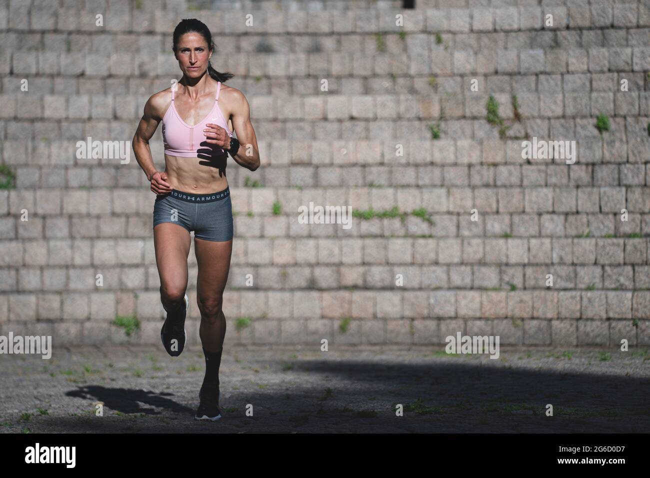 Girl running in the city, it's her lifestyle Stock Photo - Alamy