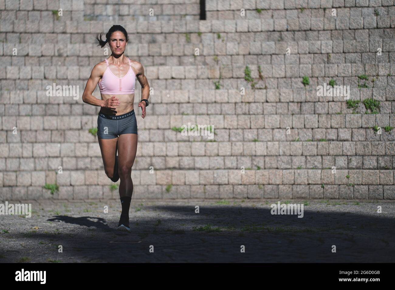 Girl running in the city, it's her lifestyle Stock Photo - Alamy