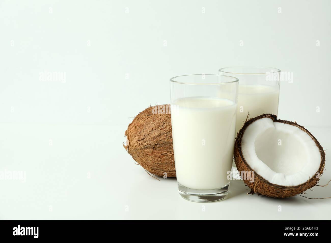Concept of coconut milk on white background Stock Photo - Alamy