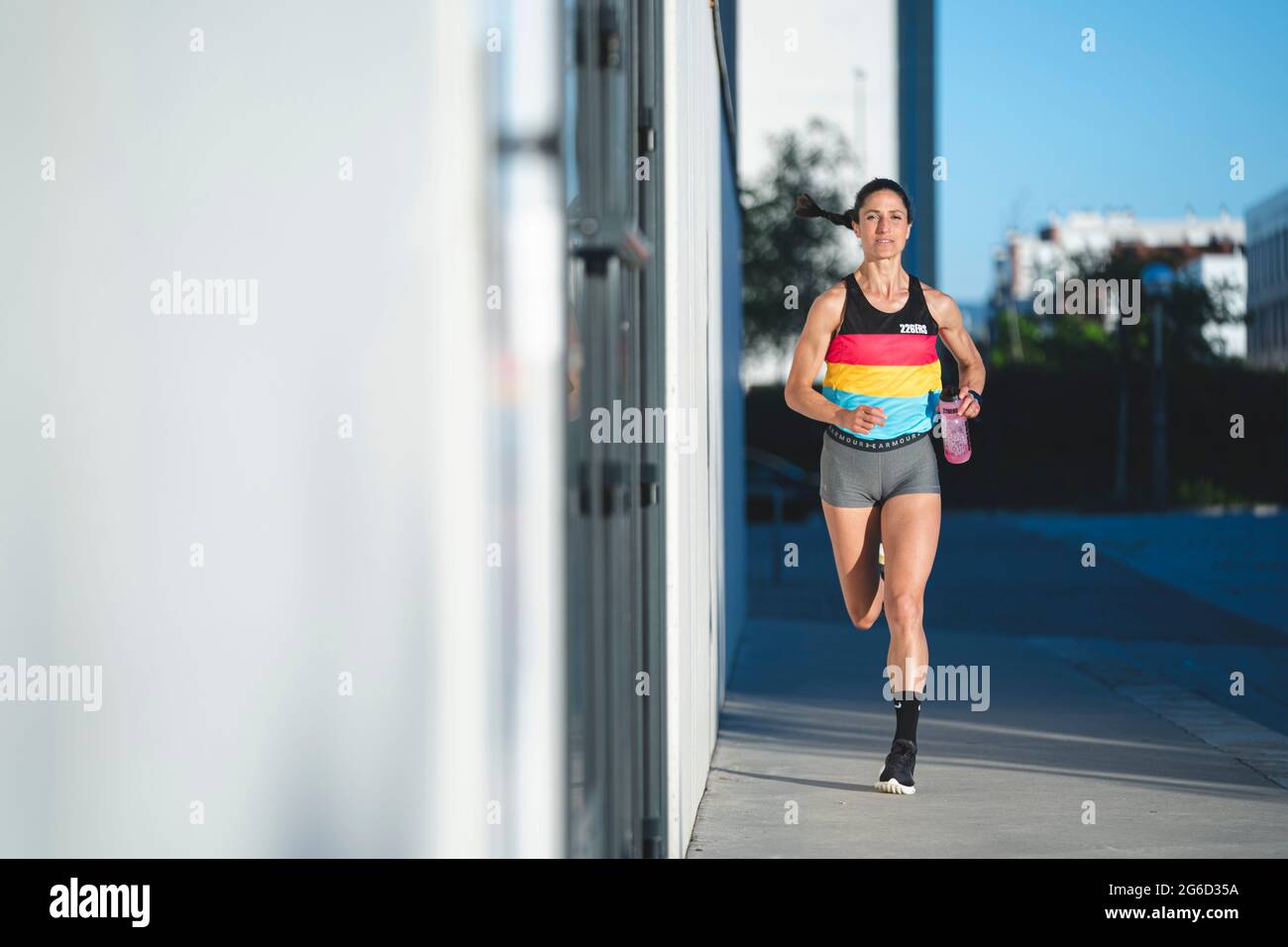 Girl running in the city, it's her lifestyle Stock Photo - Alamy
