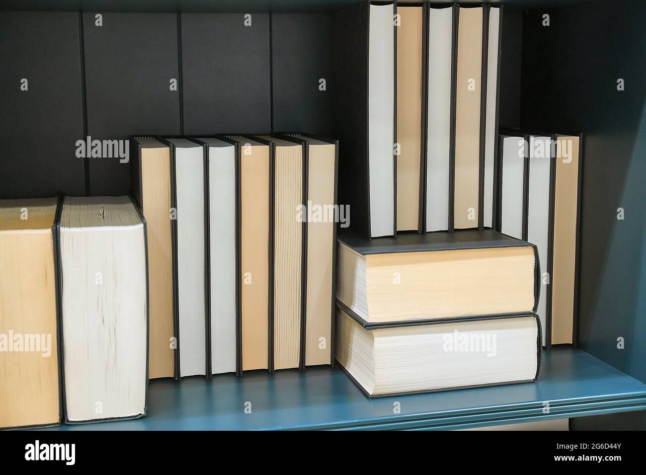 Books on a shelf Stock Photo - Alamy
