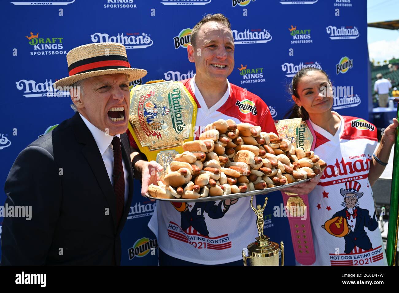 George Shea, Joey 'Jaws' Chestnut and Michelle Lesco at the 2021 Nathan ...