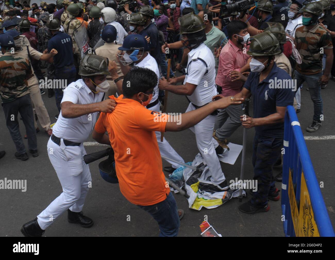 Kolkata, India. 05th July, 2021. Kolkata police personnel clash with BJP activists during a ...