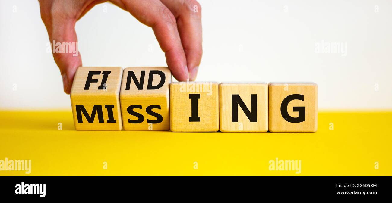 Finding or missing symbol. Businessman turns wooden cubes and changes ...