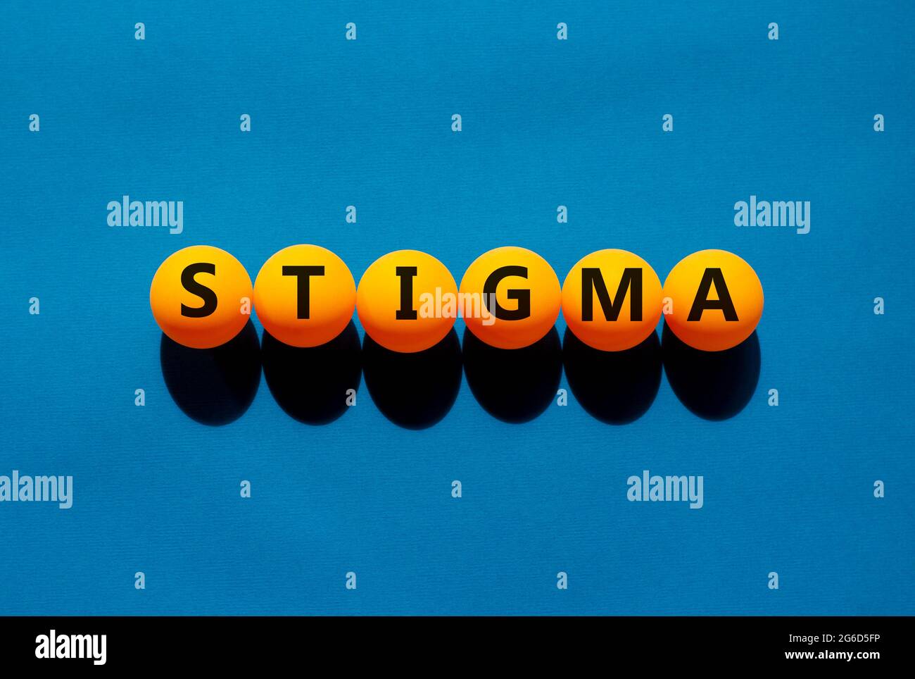 Medical and stigma symbol. The concept word 'stigma' on orange table ...