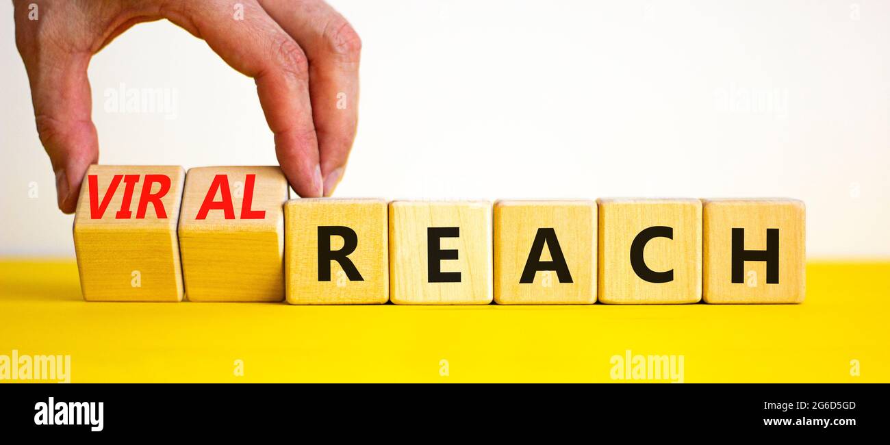 Viral reach symbol. Businessman turns wooden cubes and changes words ...
