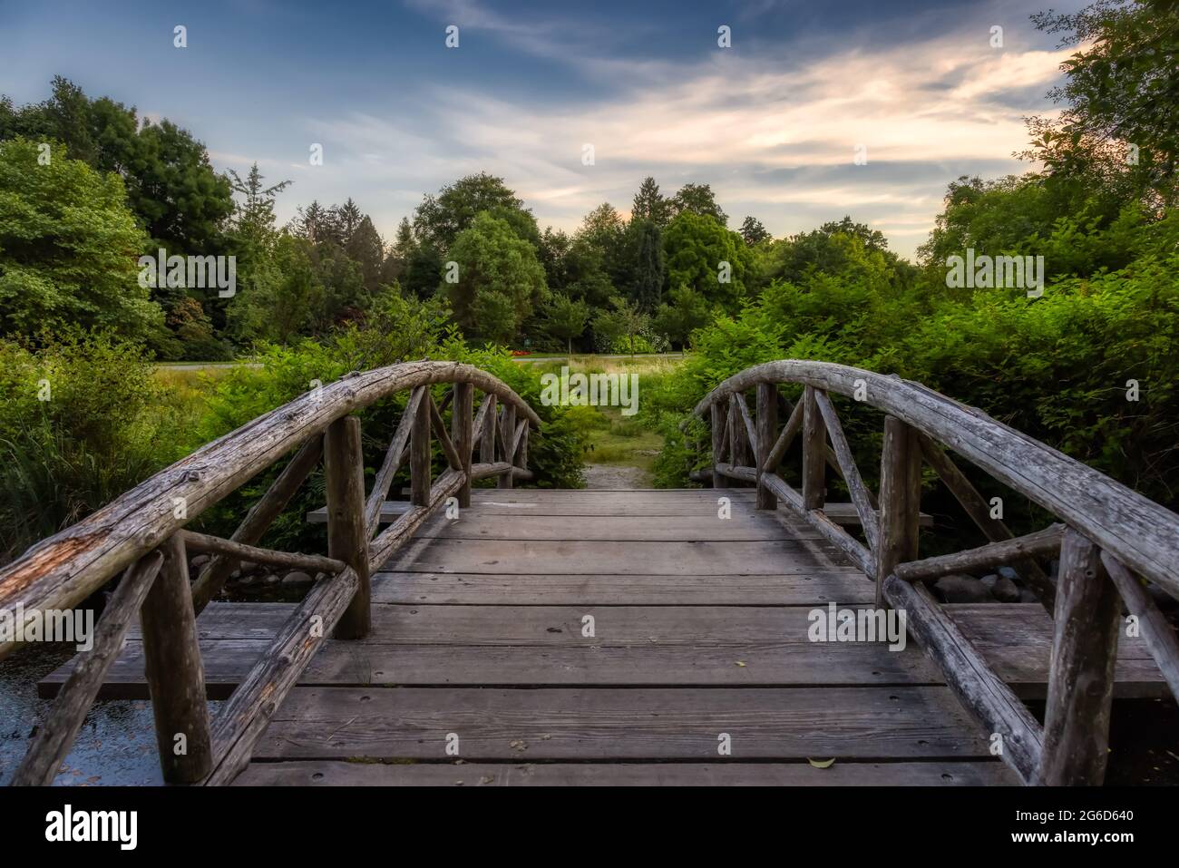 Wooden Bridge over the pond on a walking path in a famous Stanley Park ...