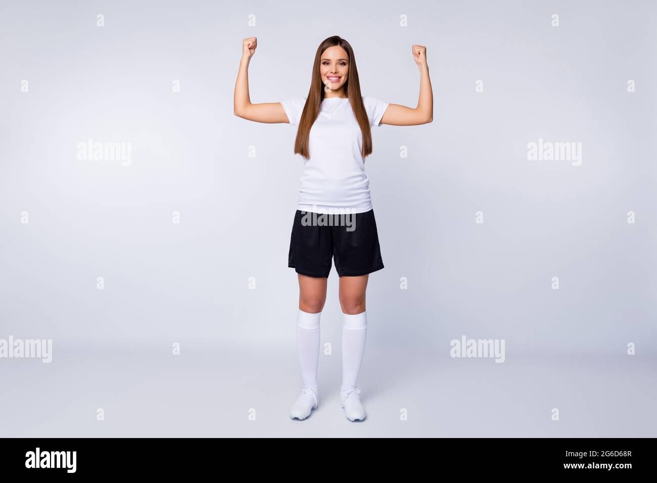 Women muscle strength showing biceps hi-res stock photography and ...