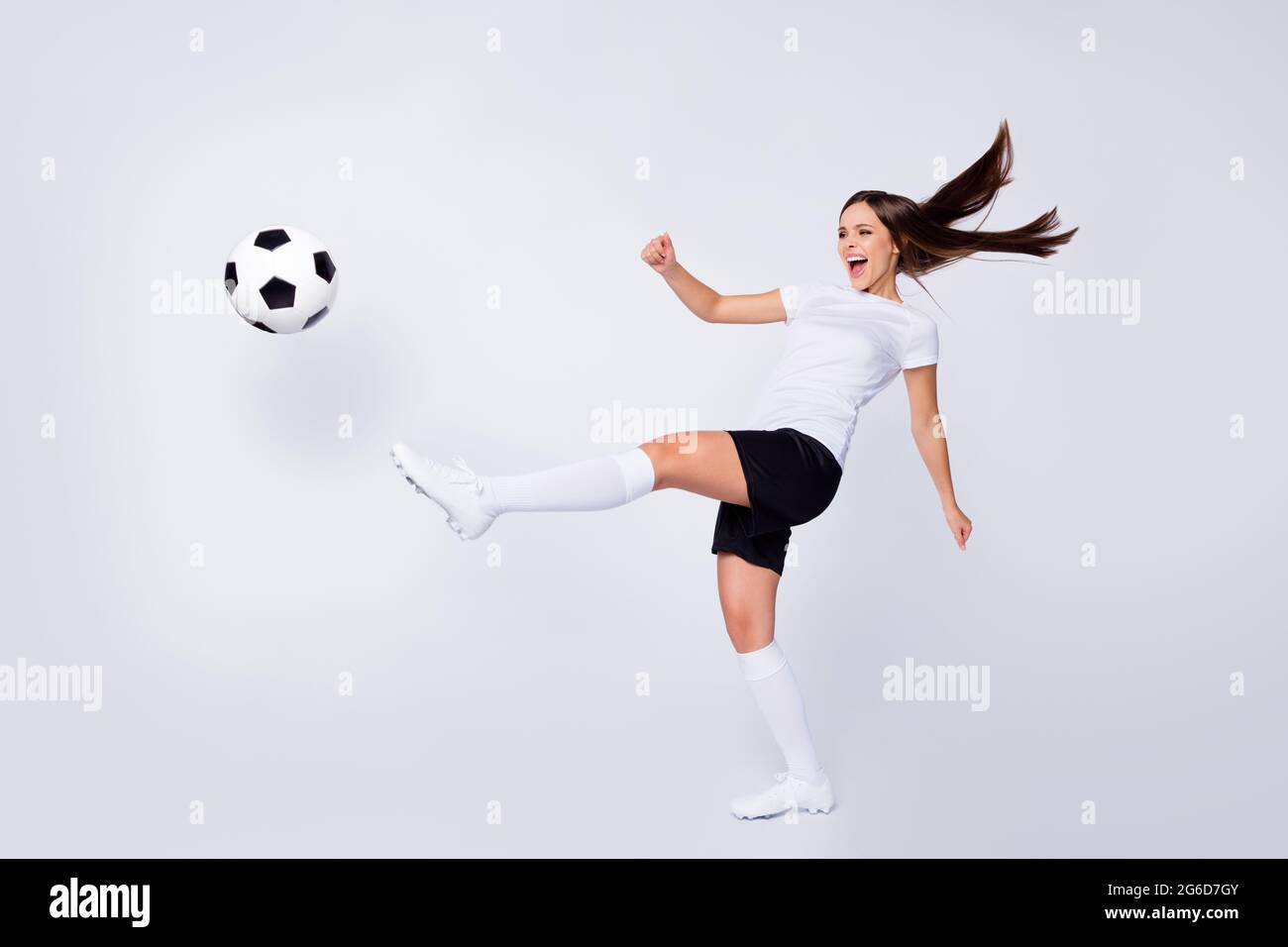 Full body photo of excited captain lady player soccer women team kick ...