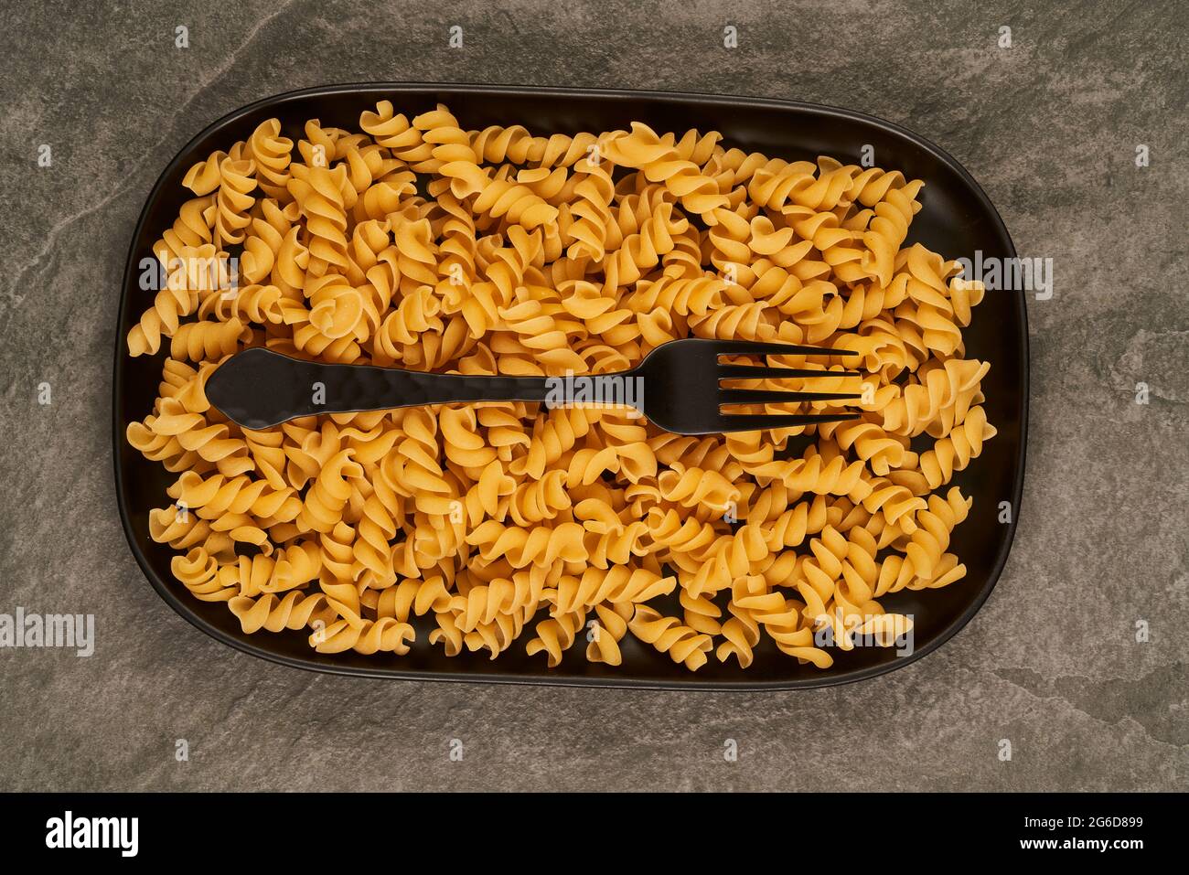 Uncooked pasta fusilli hi-res stock photography and images - Alamy