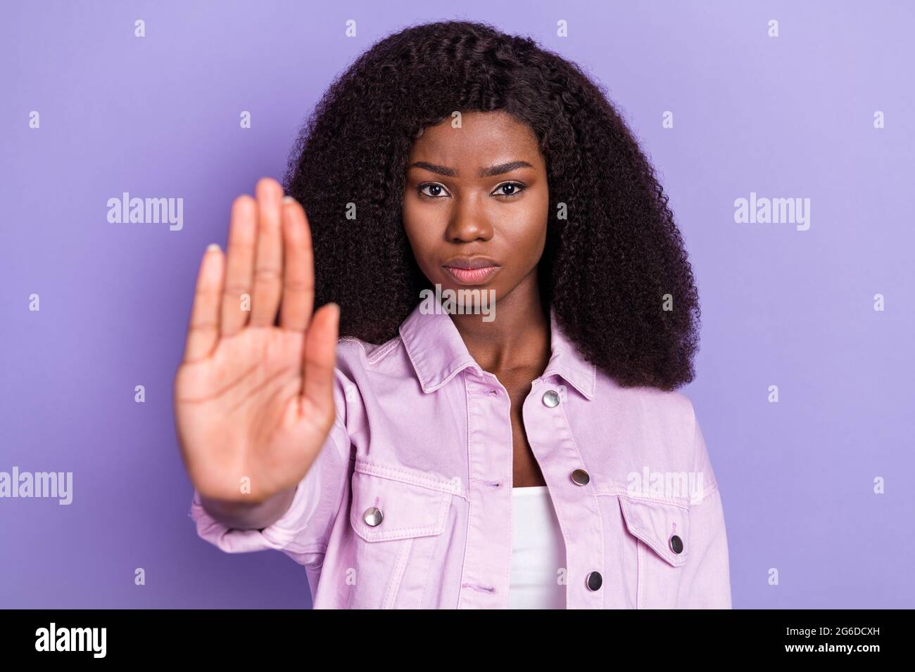 Photo of young serious beautiful african woman showing stop sign ...