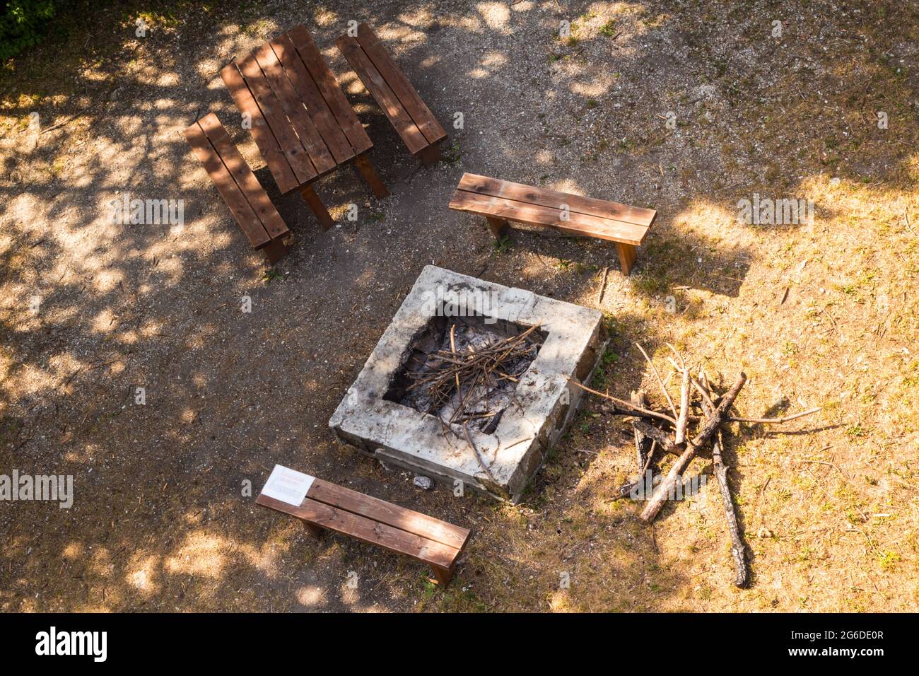 Campfire place and benches in forest viewed from lookout tower directly ...