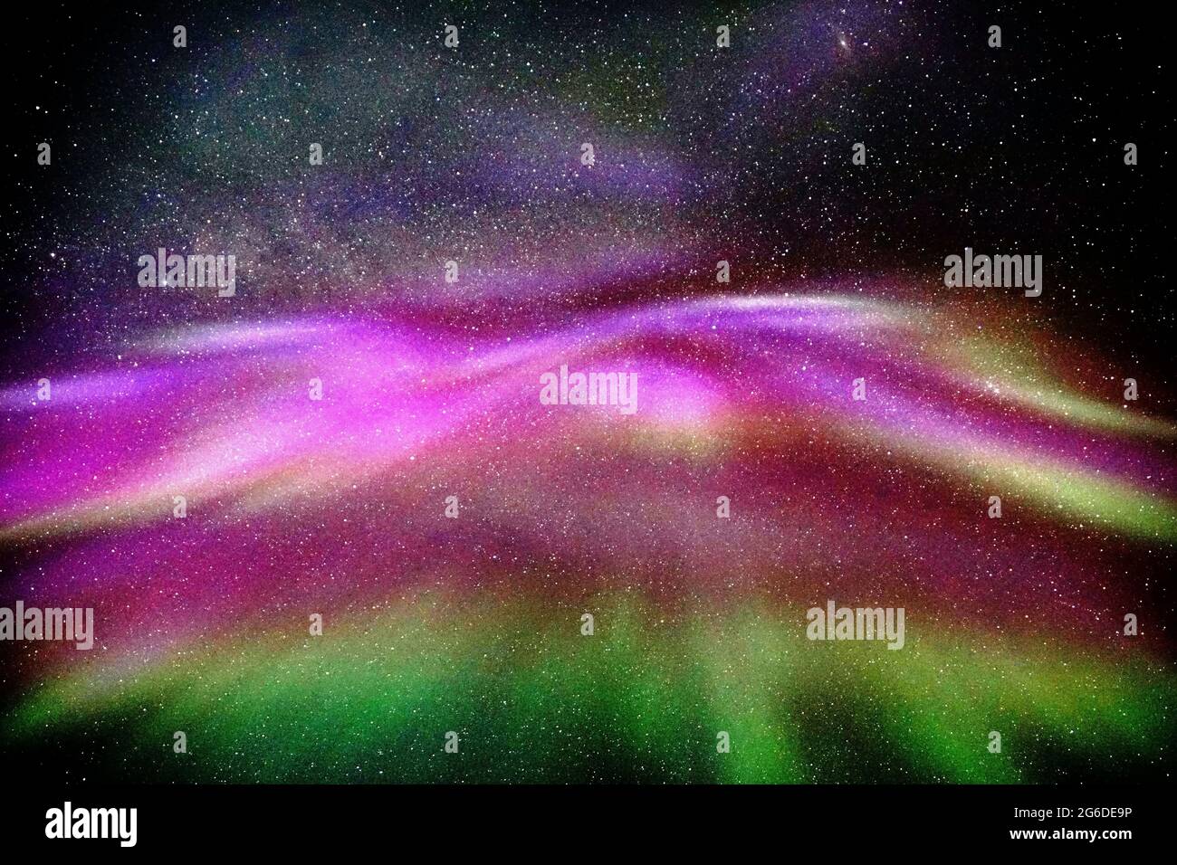 Spectacular green and pink Northern Lights in Tromso Stock Photo - Alamy