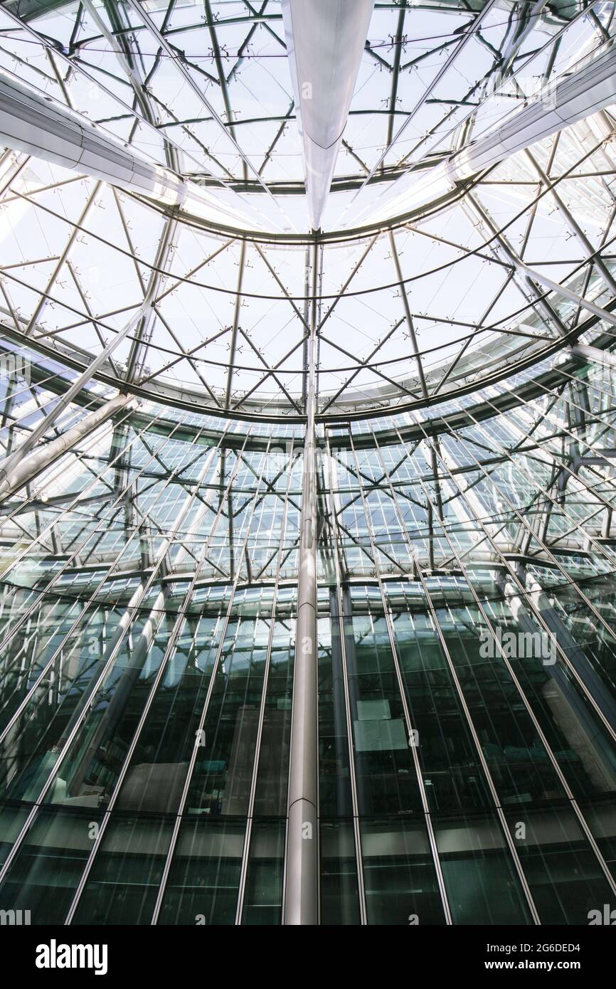 From below of cables inside of contemporary building with glass roof ...