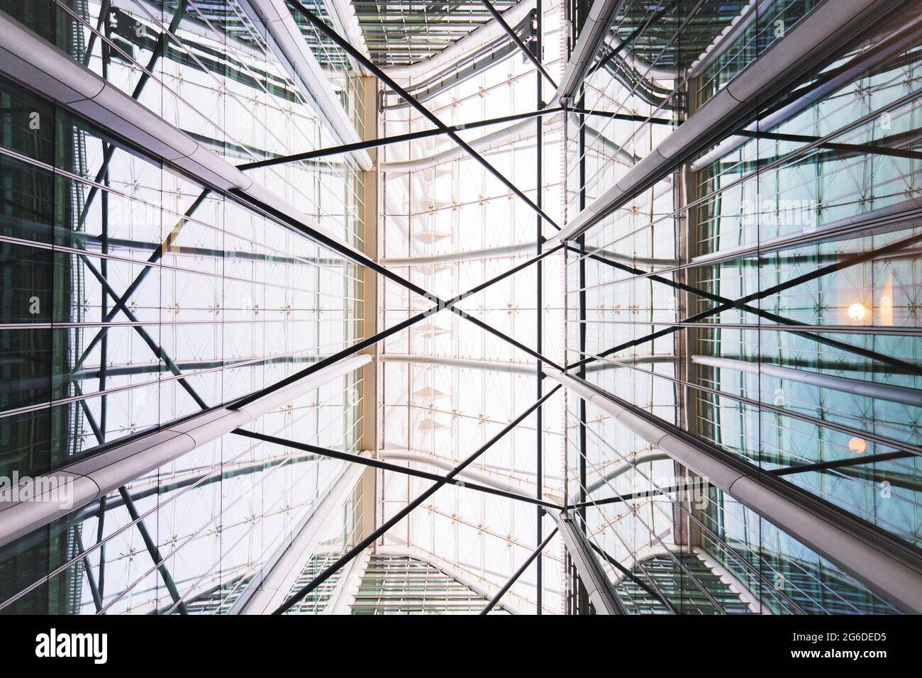 From below of cables inside of contemporary building with glass roof ...
