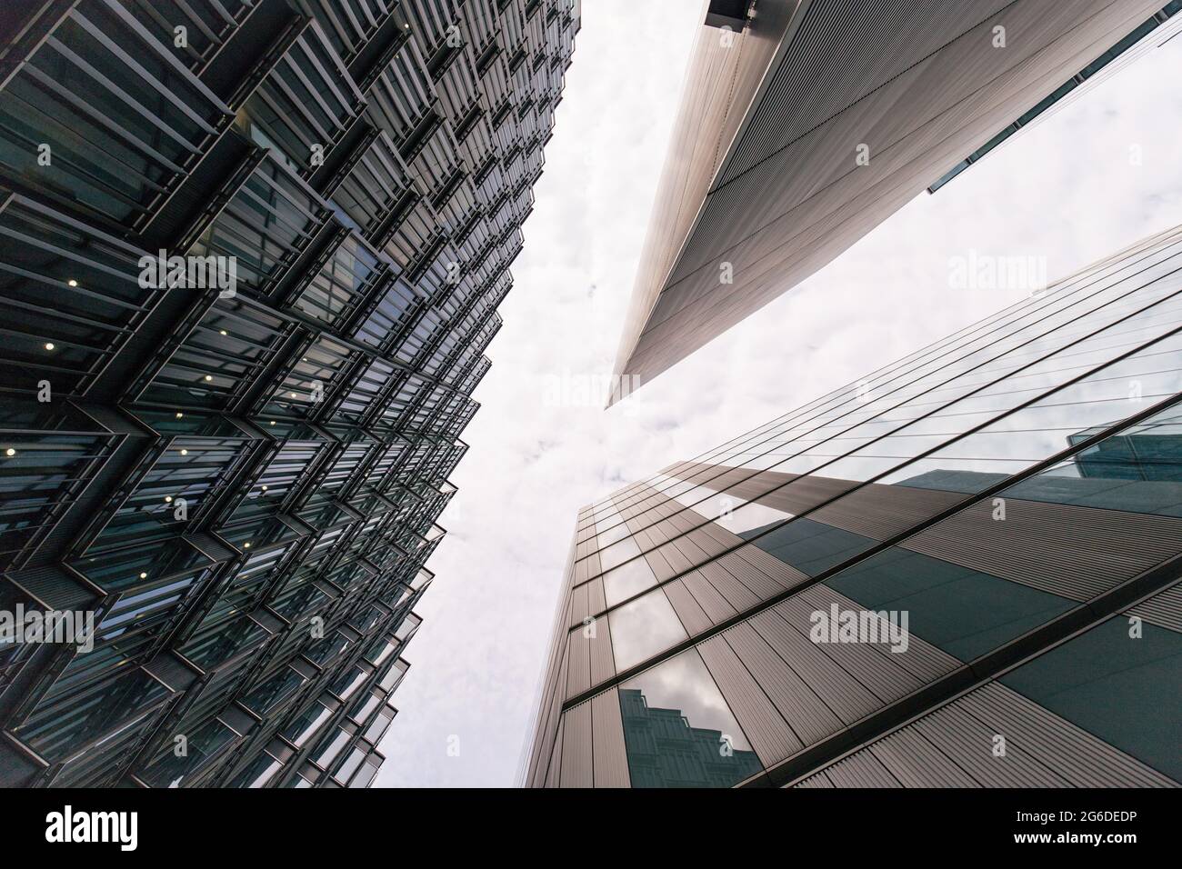 From below perspective of facades of modern skyscrapers with ...