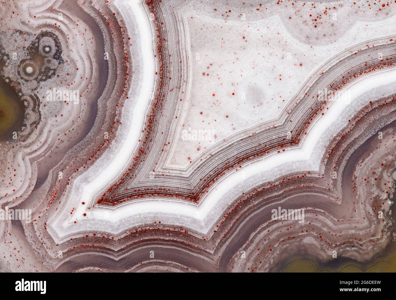 Macro of abstract background of agate gemstone with white and red spots ...