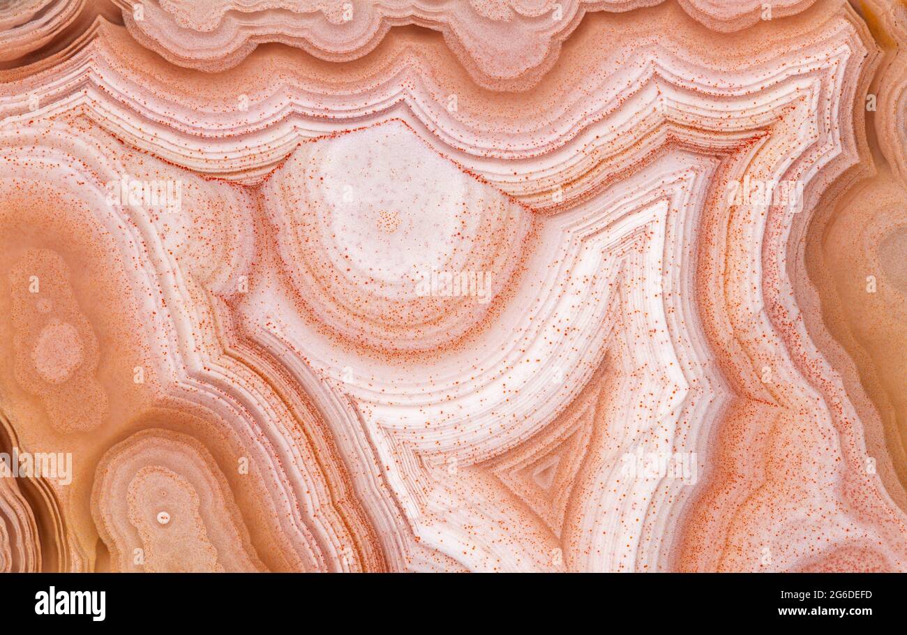 Macro of abstract background of agate gemstone with white and red spots ...