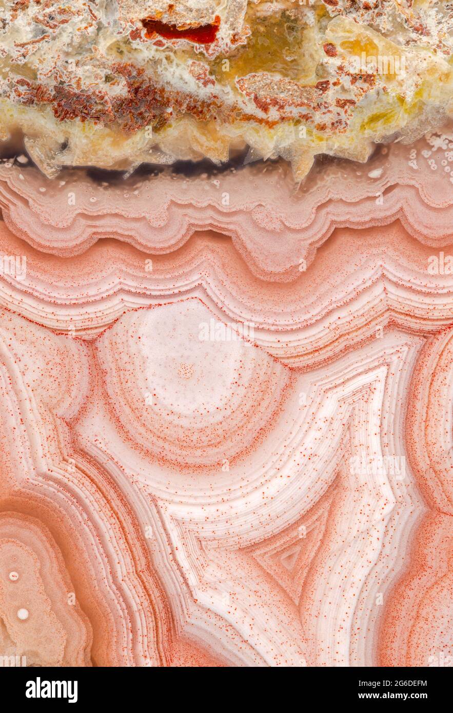Macro of abstract background of agate gemstone with white and red spots ...