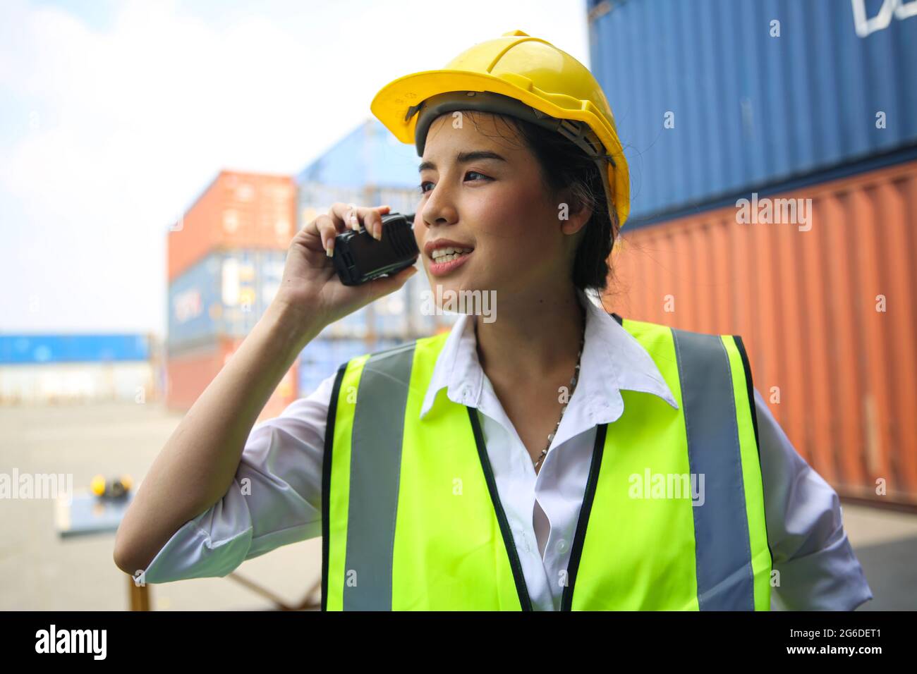 Foreman control loading Containers box from Cargo freight ship for ...
