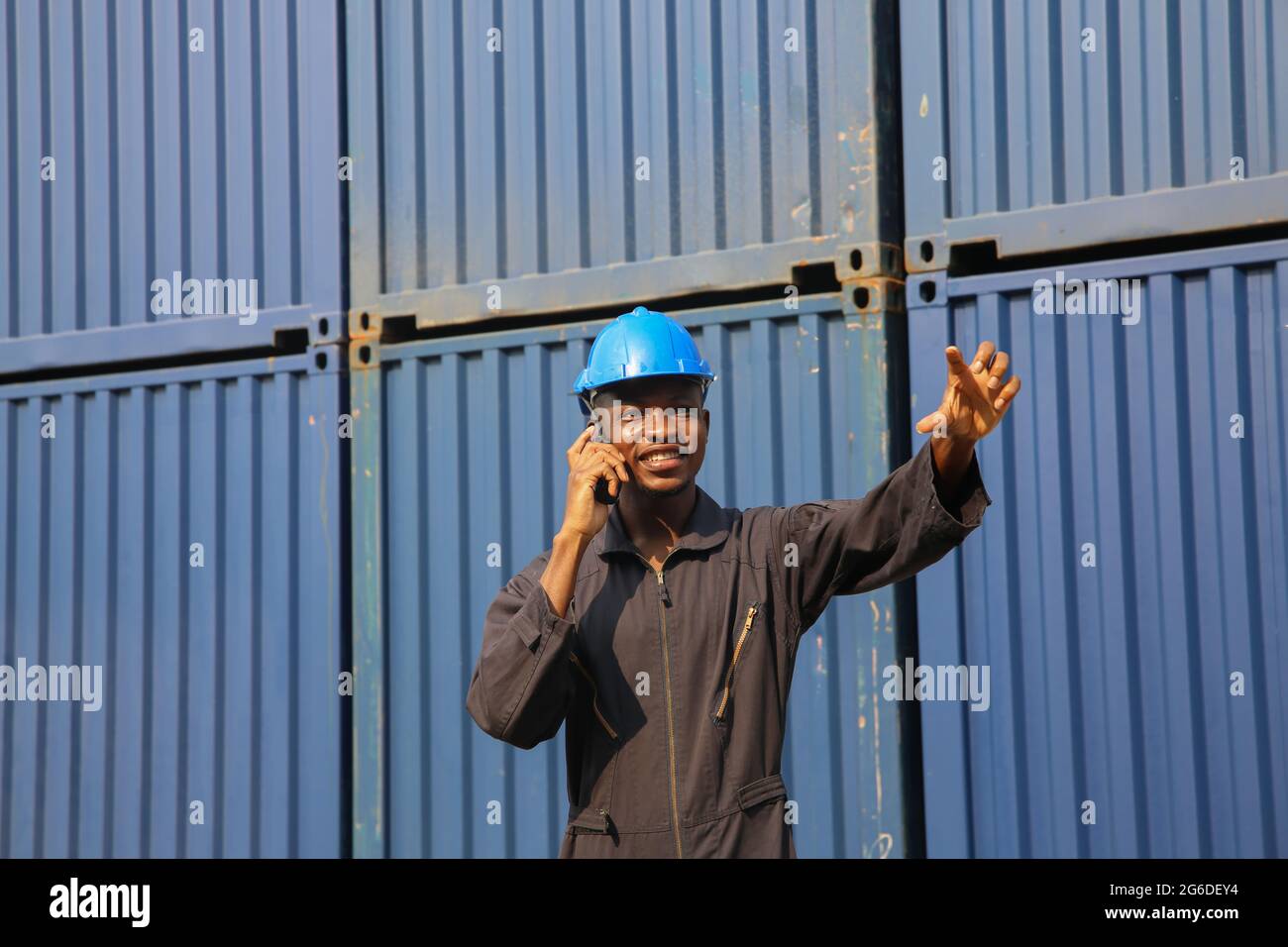 Foreman control loading Containers box from Cargo freight ship for ...