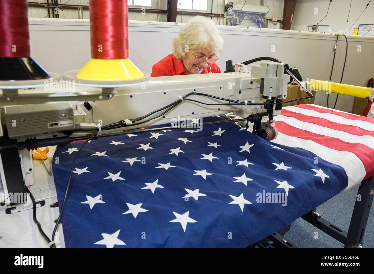 Woman sewing American Flag in commercial factory Stock Photo - Alamy