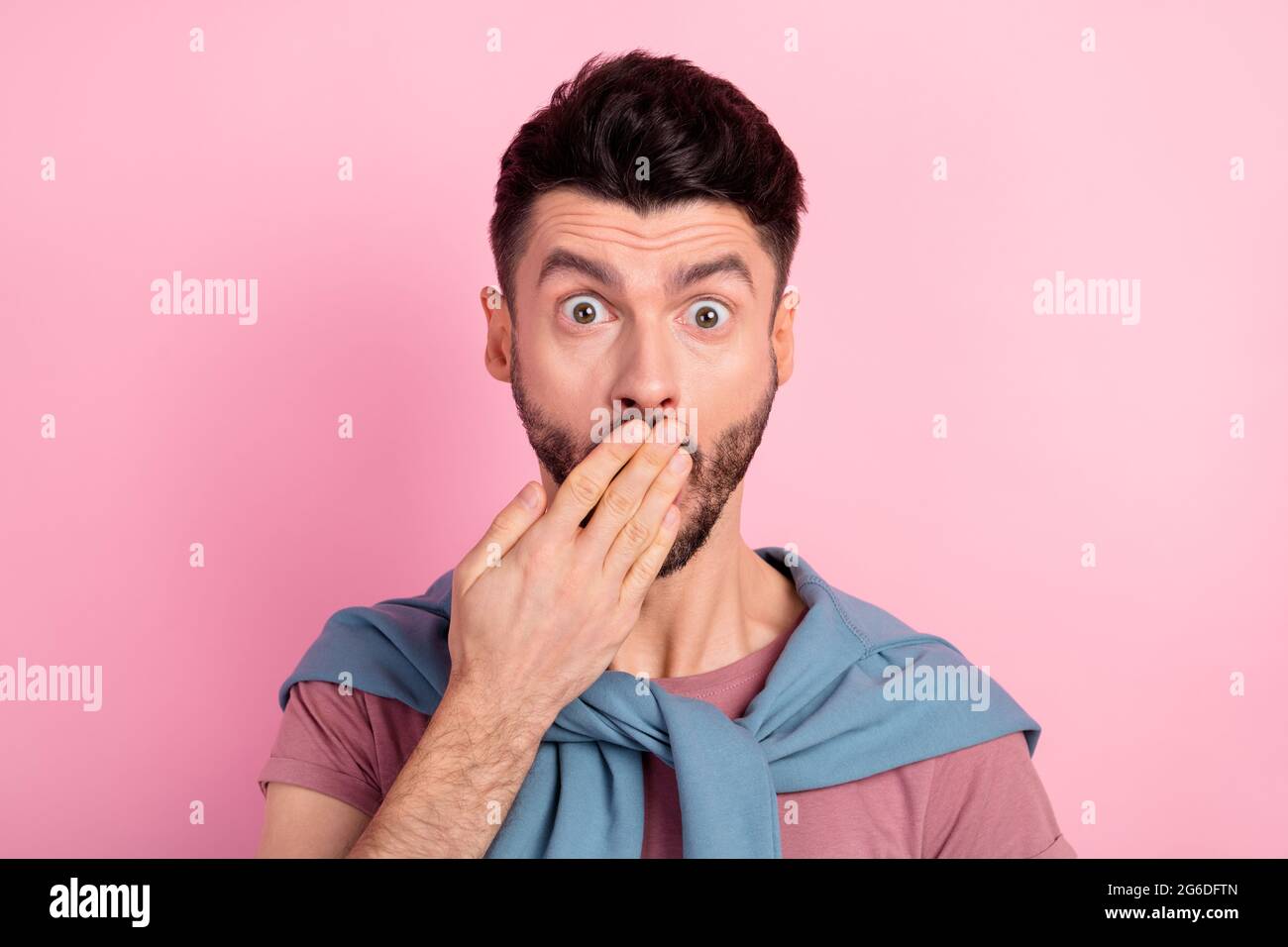 Photo of shocked guilty young man hold cover hand mouth secret mistake ...