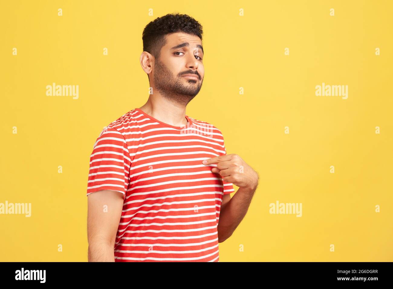 Egocentric selfish man pointing finger at himself, looking with pride ...