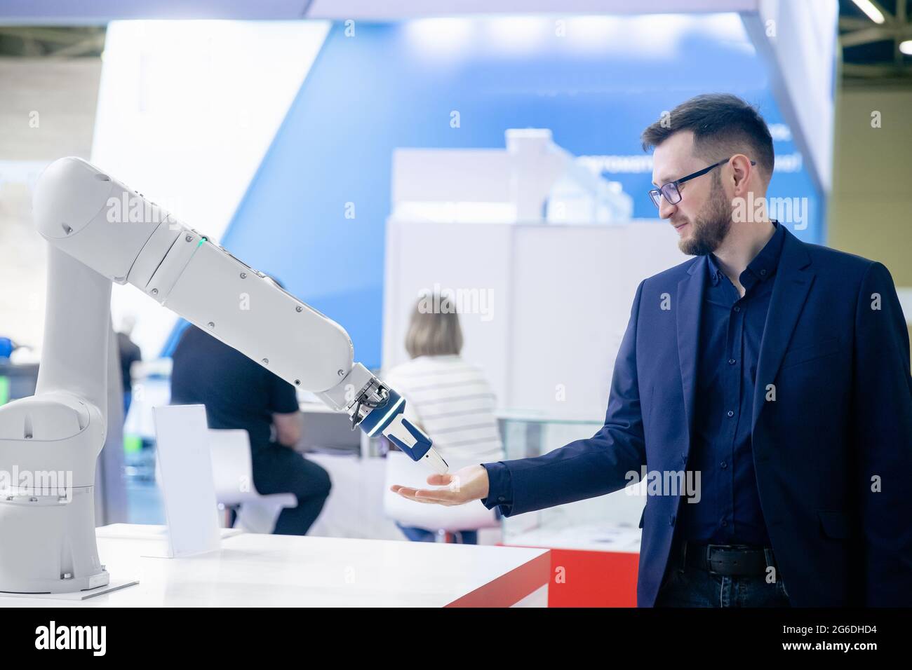 Concept communication engineer man and robot hand with handshake ...