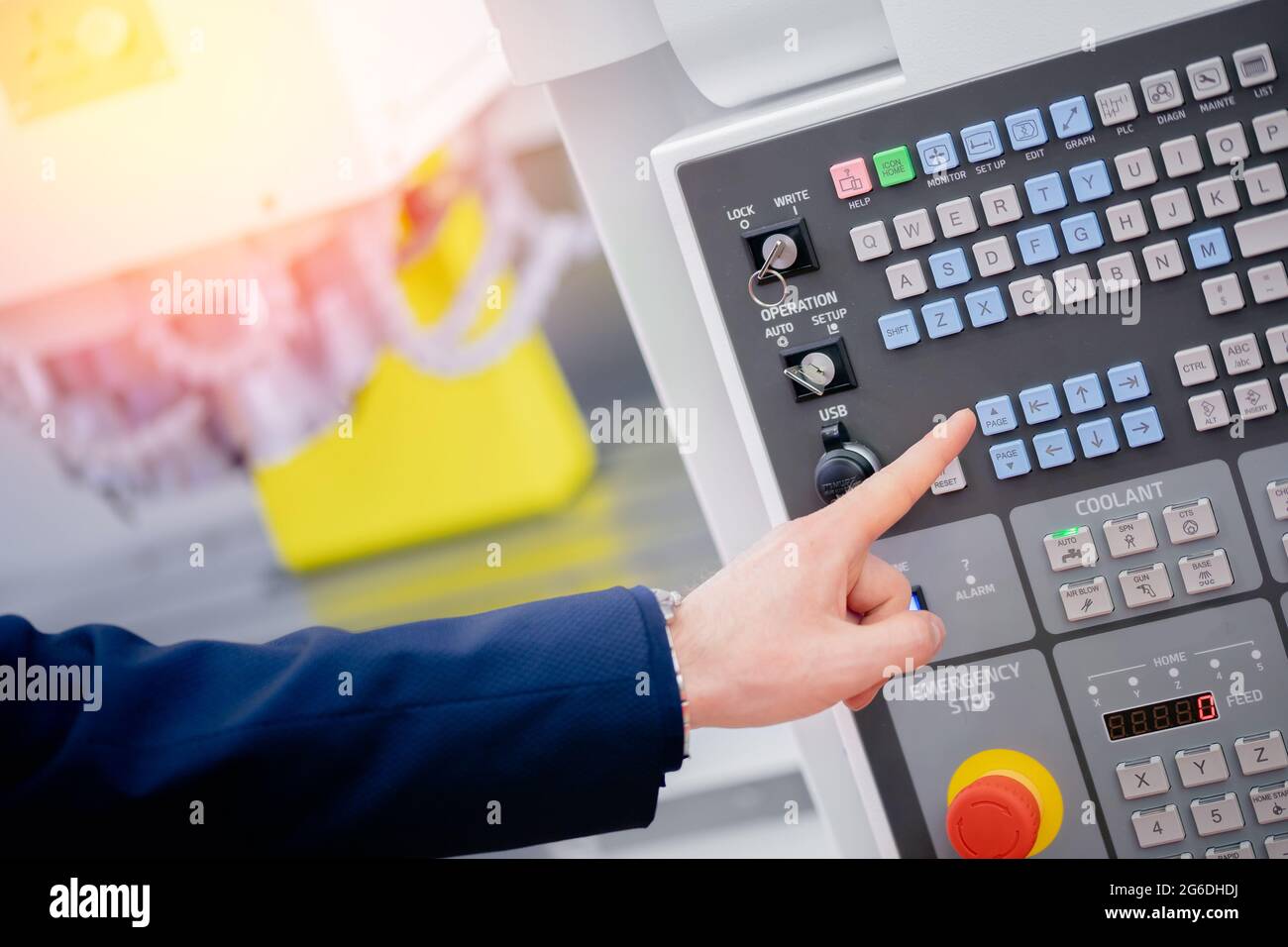 Hand push start button CNC machine at factory floor to get metal detail ...