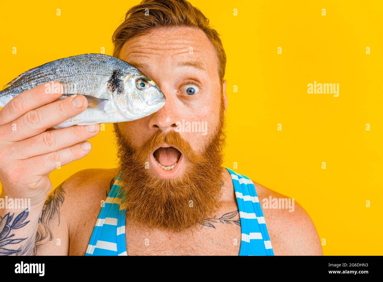 Bearded Man Eating Fish